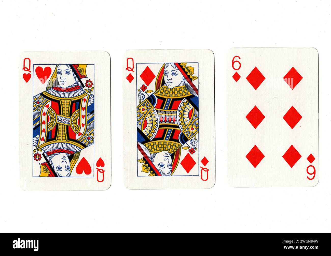 Vintage playing cards showing a pair of red queens and a red six ...