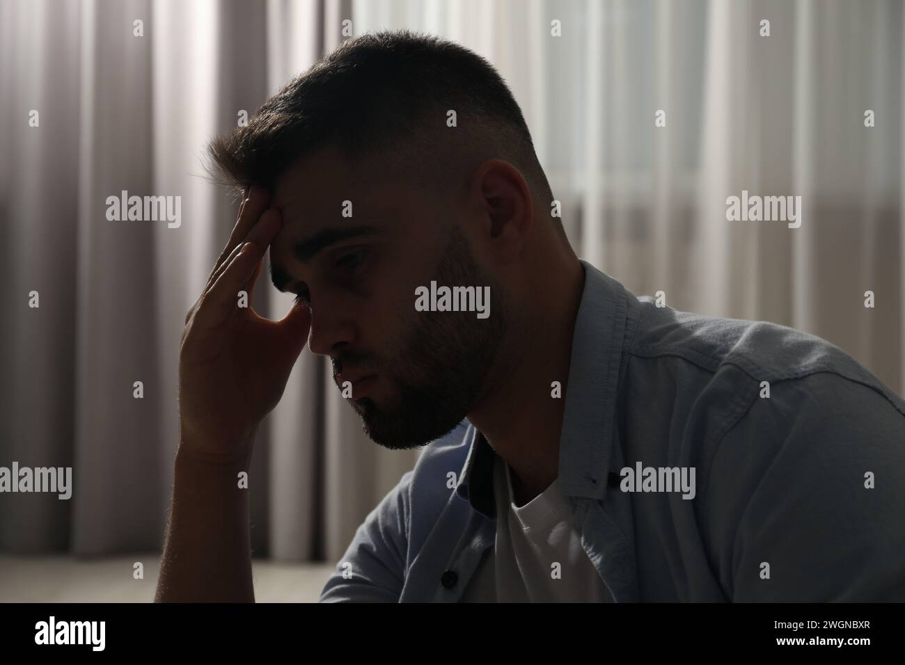 Sad man on blurred hi-res stock photography and images - Alamy