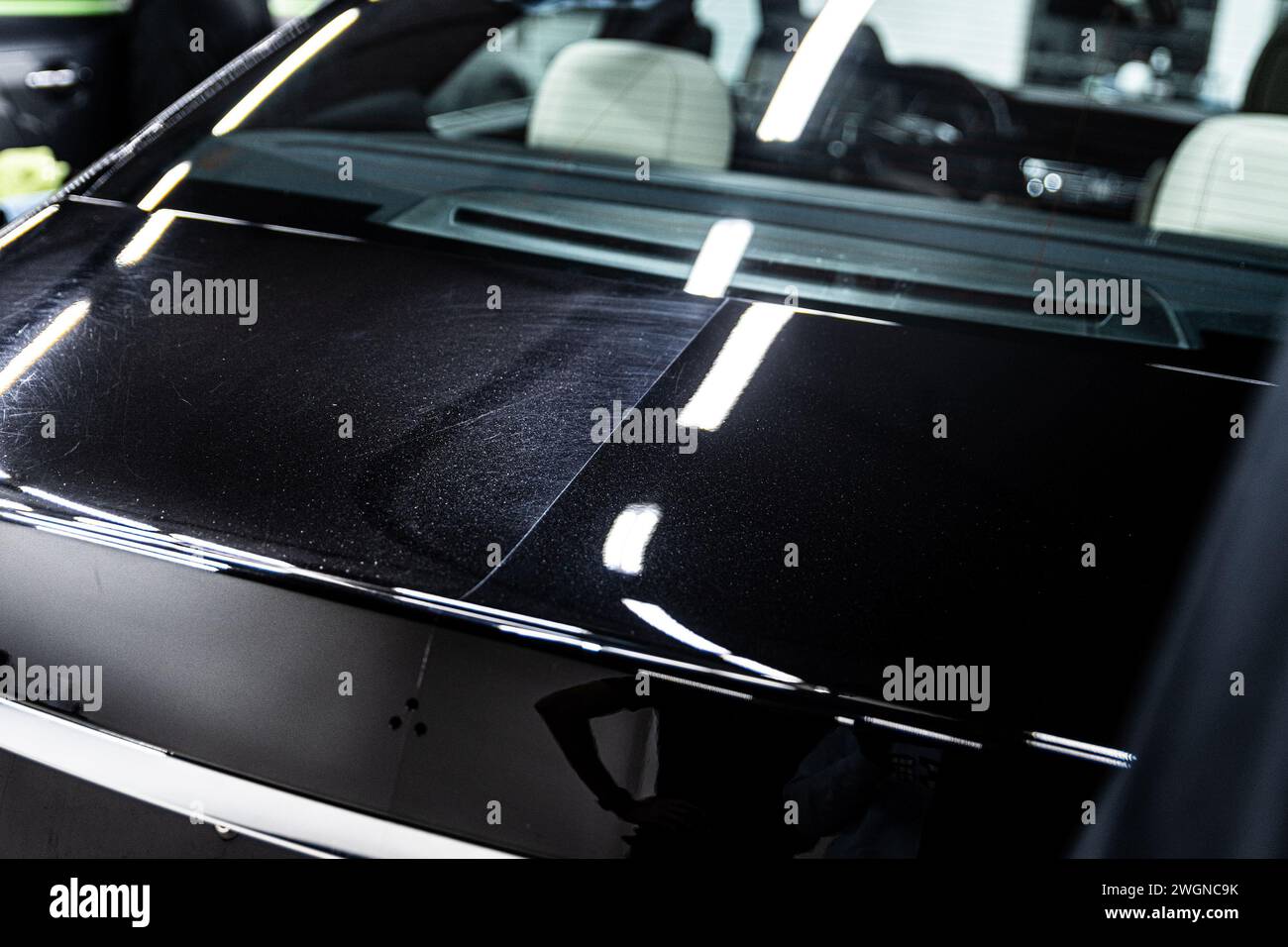 Stunning glossy finish on a luxury car hood, showcasing meticulous ...