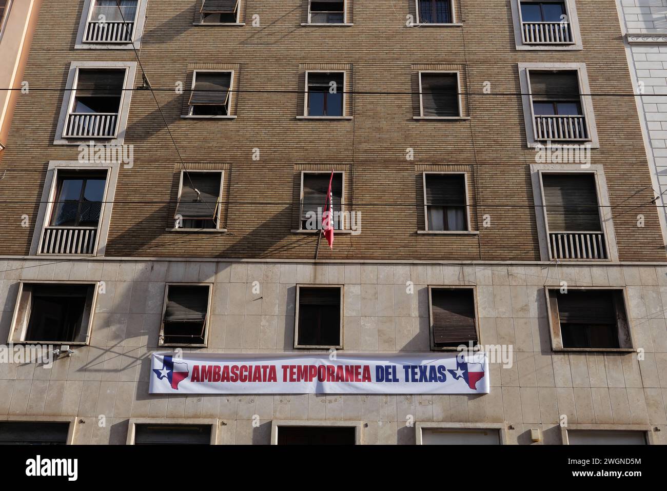 SIGN OF TEMPORARY EMBASSY OF TEXAS. ON THE WALL OF A BUILDING OCCUPIED ...