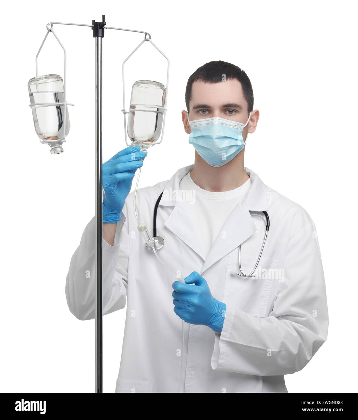 Doctor setting up IV drip on white background Stock Photo - Alamy