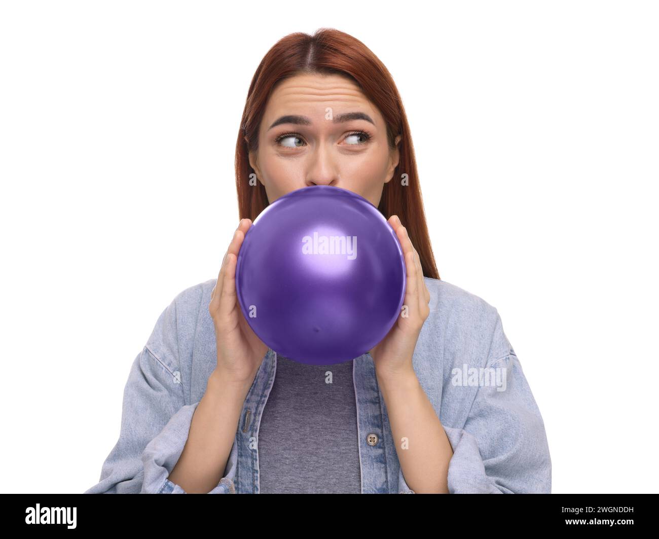 Woman inflating purple balloon on white background Stock Photo - Alamy