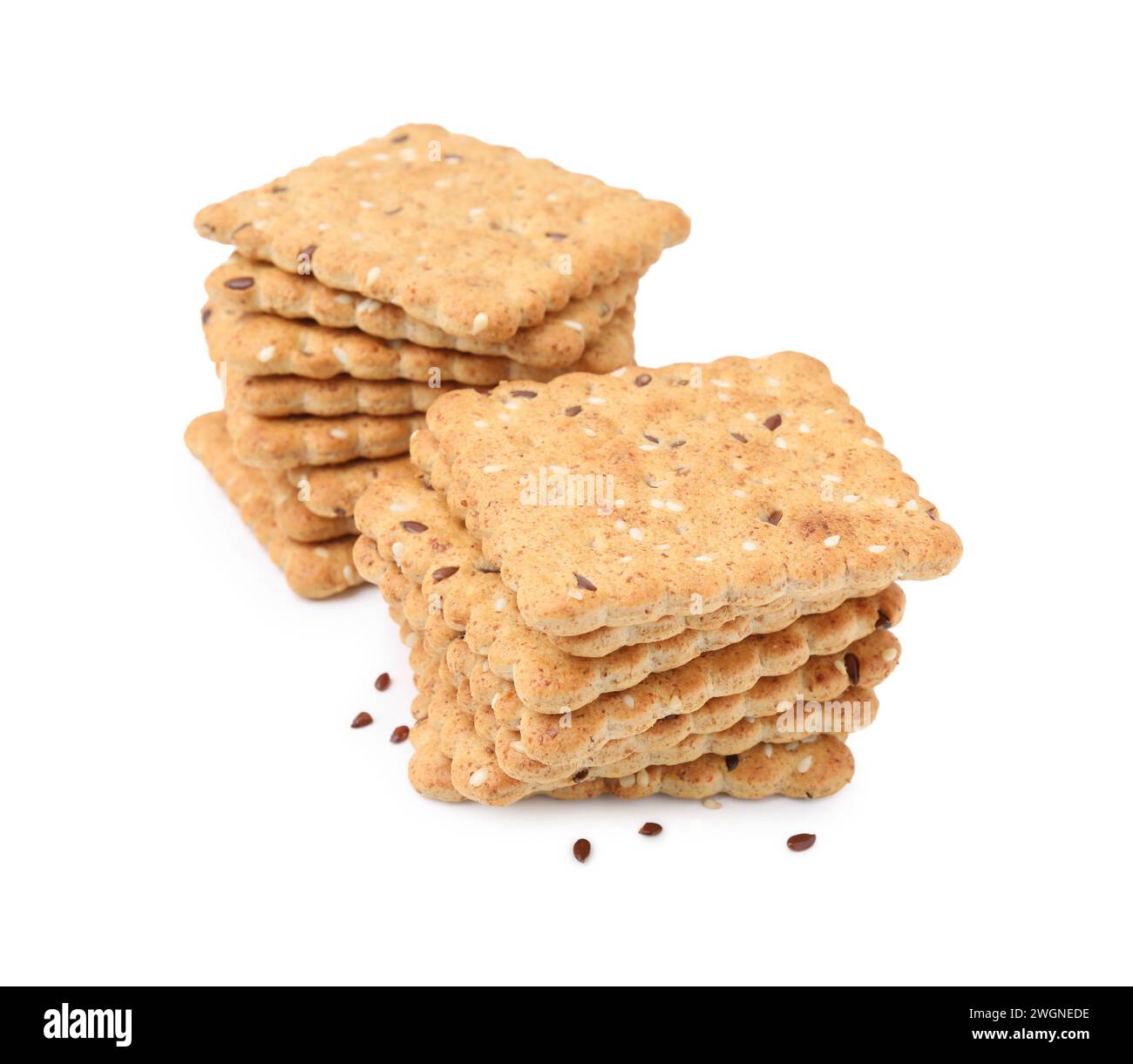 Stacks of cereal crackers with flax and sesame seeds isolated on white ...