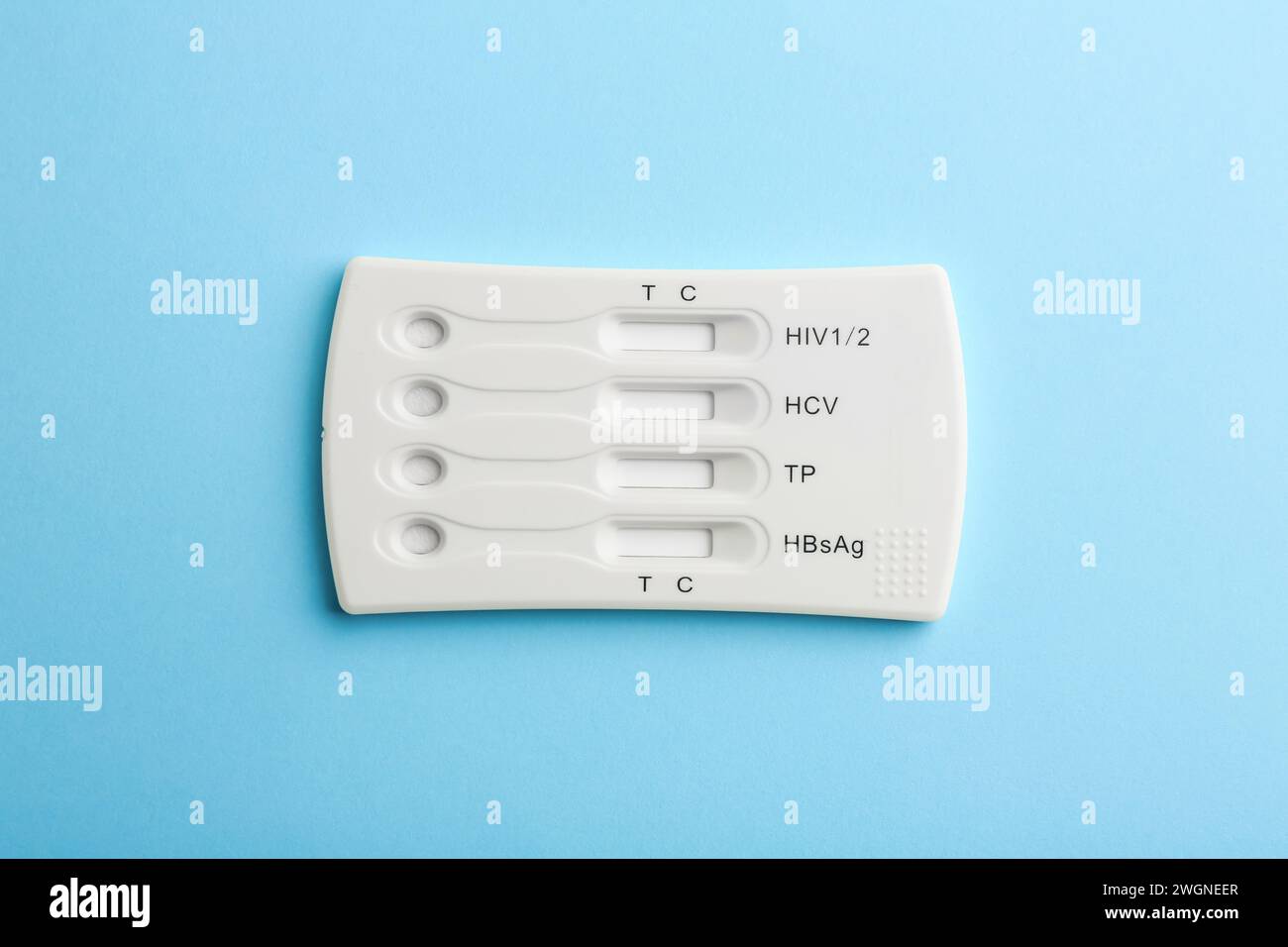 Disposable multi-infection express test on light blue background, top ...