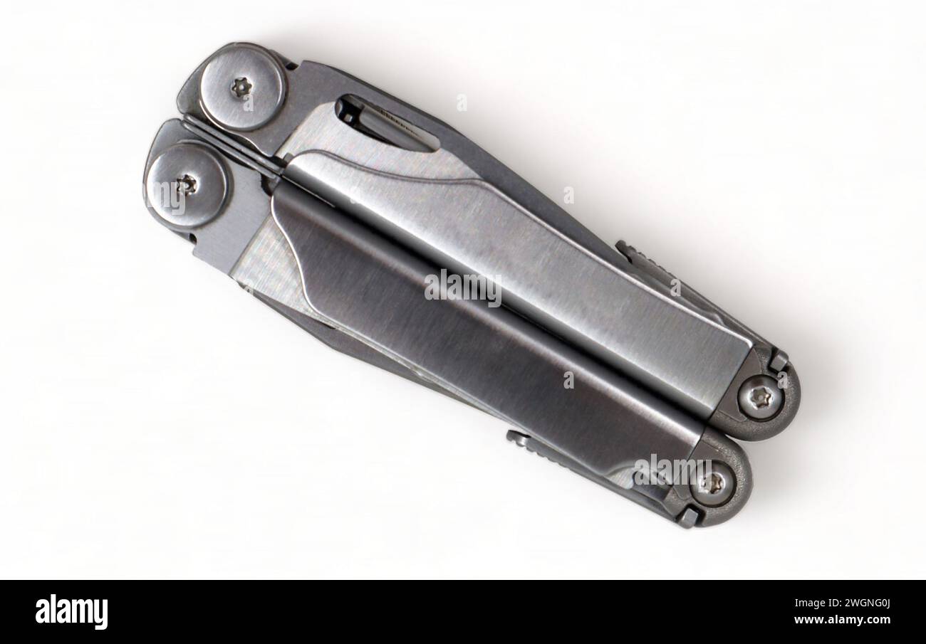 Folded steel multitool isolated on white background, top view. A tool ...