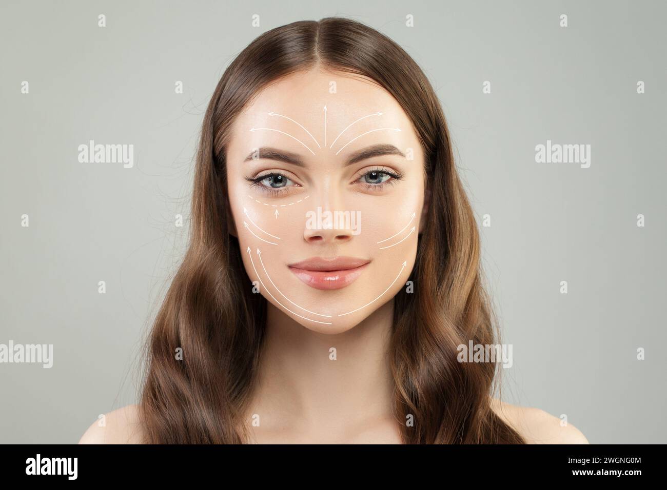 Grid of lines showing facial lifting effect on fresh skin of beautiful young woman with healthy ...