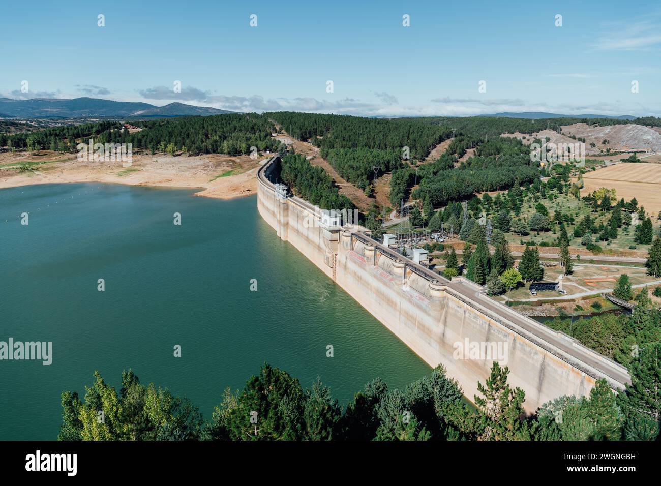 Hydroelectric dam with low water level in summer. Aguilar de Campoo ...