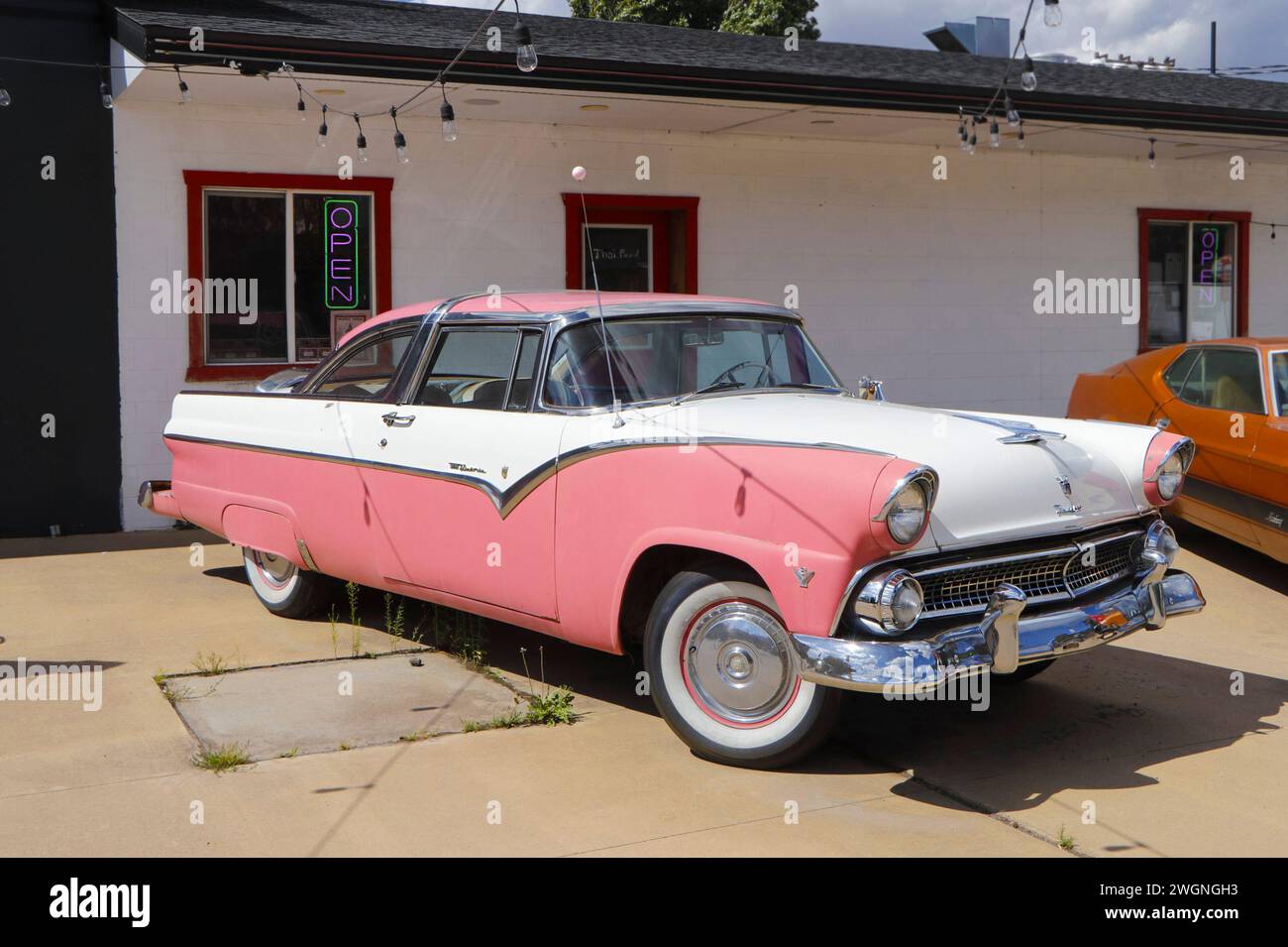 1956 pink Ford Fairlane outside American diner in Williams arizona ...