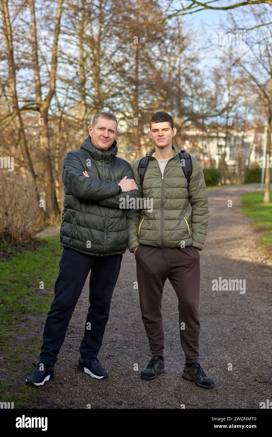 Father-Son Bond: Handsome 40-Year-Old Man and 17-Year-Old Son Standing ...