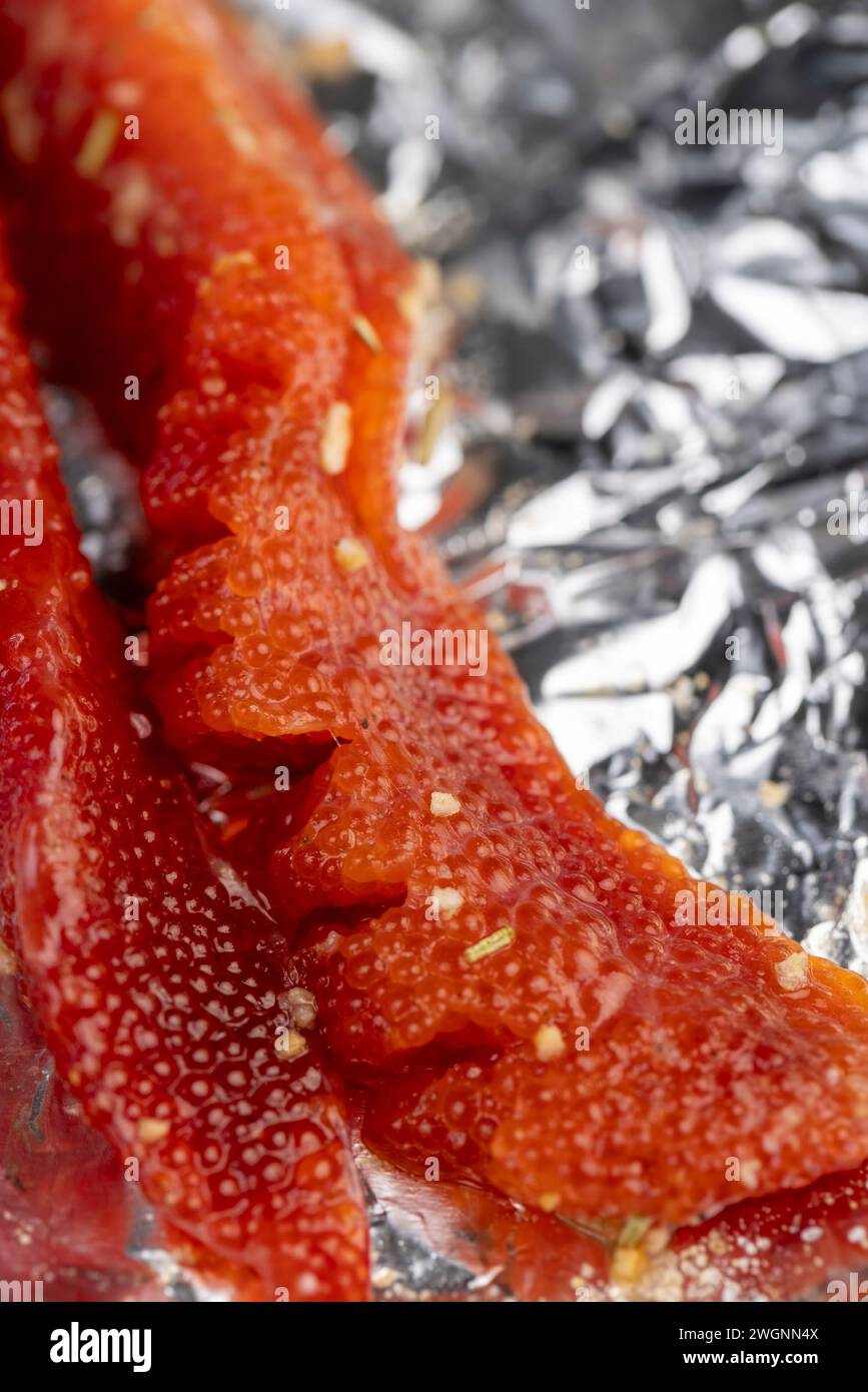 red trout caviar while cooking in foil, cooking a fish dish with expensive red salmon caviar ...