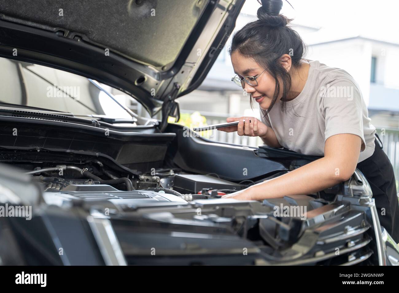 Need help with car breakdown Serious woman listens to advice and explanation of emergency car ...