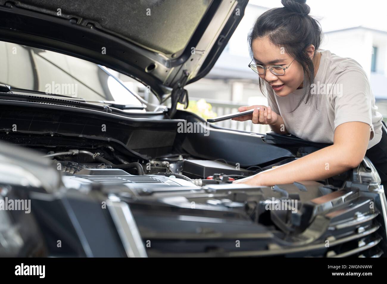 Need help with car breakdown Serious woman listens to advice and ...