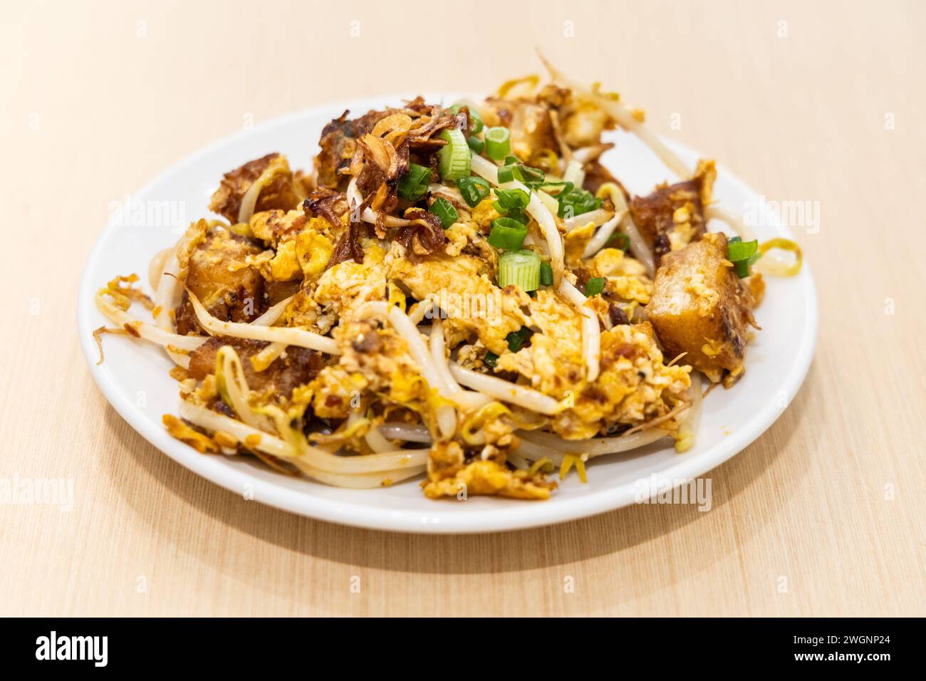 Fried raddish cake or cai tau kueh, a traditional Chinese food served ...