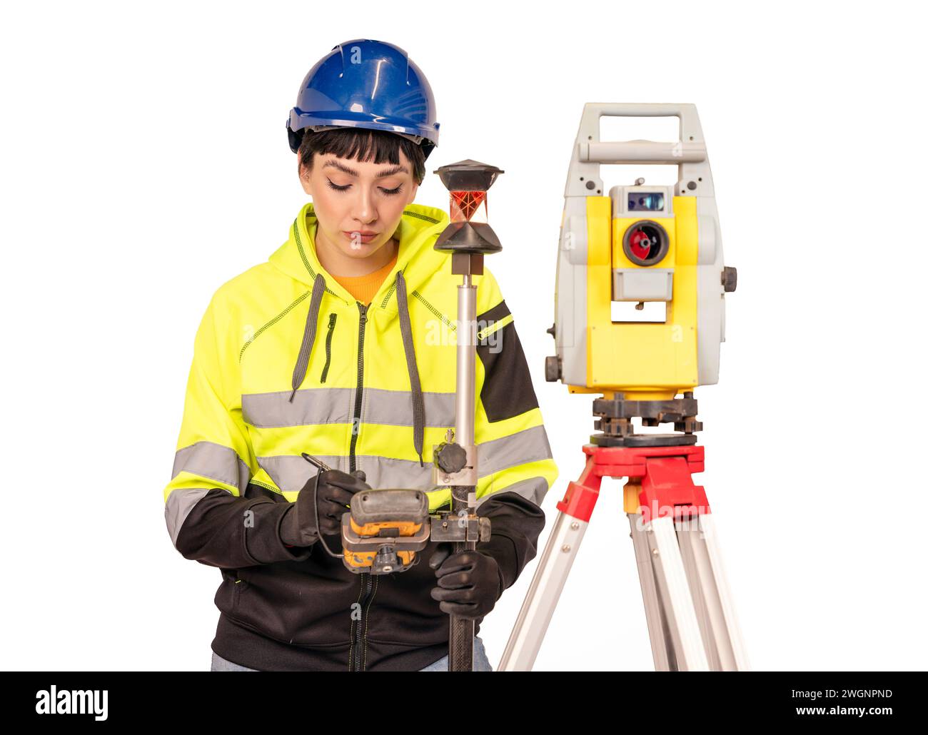 Smiling Woman in hard hat and protective clothes land surveyor working ...