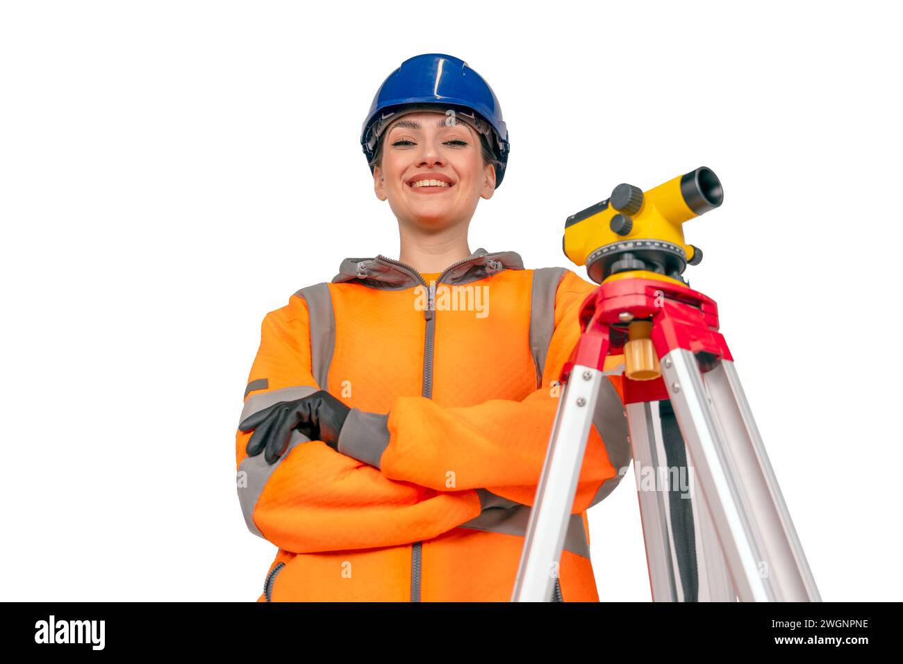 Smiling Woman in hard hat and protective clothes land surveyor working ...