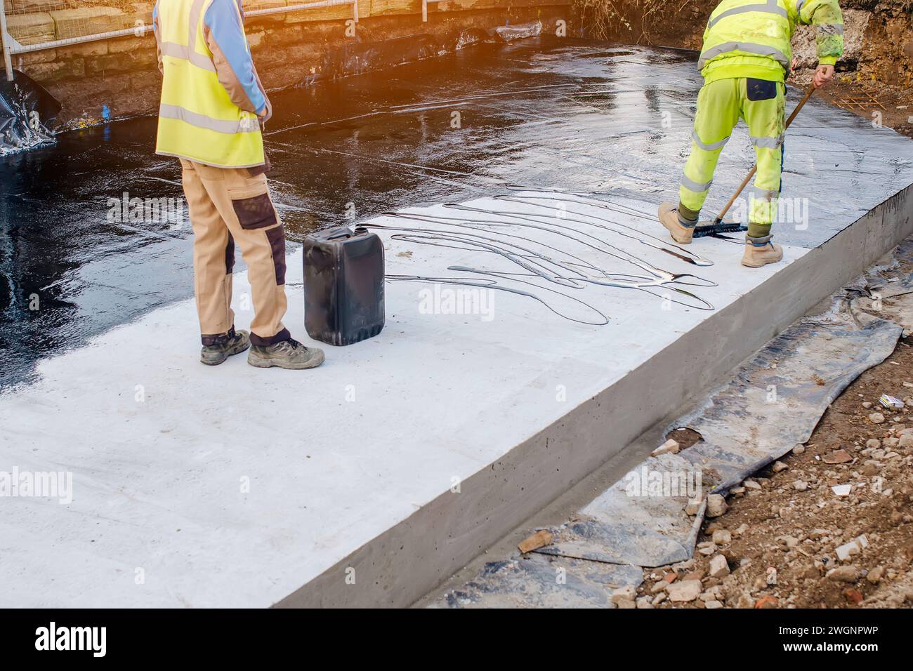 Applying bitumen mastic waterproofing surface hi-res stock photography ...