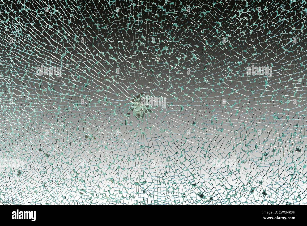 Full frame shot of a broken safety glass pane in gradient back Stock ...
