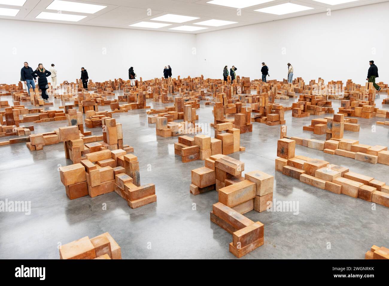 Visitors looking at 'Resting Place' (2023) sculpture at 'Body Politic ... Visitors looking at 'Resting Place' (2023) sculpture at 'Body Politic ...