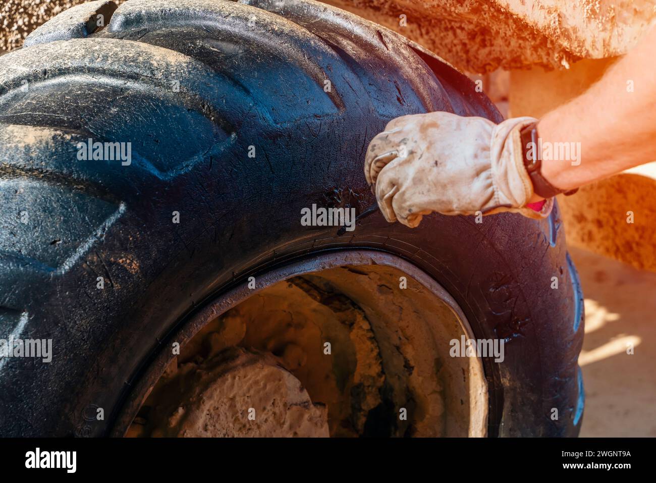 A dumper tire got a puncture and is being repaired on the building site ...