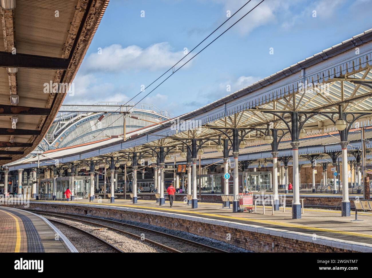 Historic 19th Century Railway platforms with canopies curve inwards. A ...