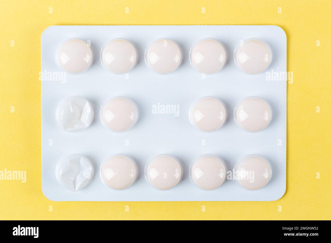 medicine blister packs viewed from above with two tablets missing Stock ...