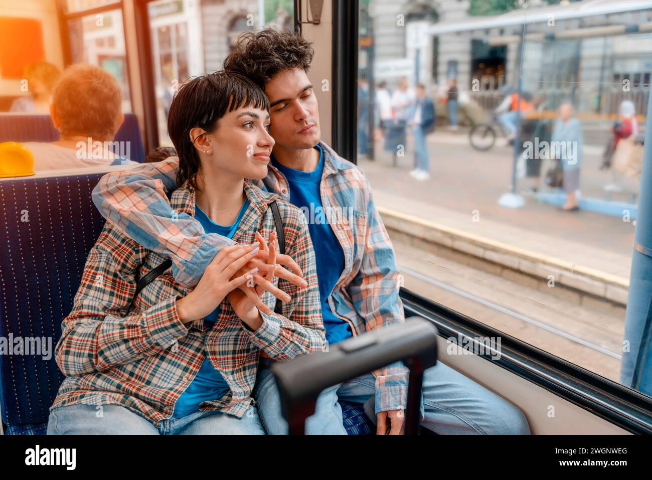 couple hugging on a bus, tram Lifestyle concept Stock Photo - Alamy