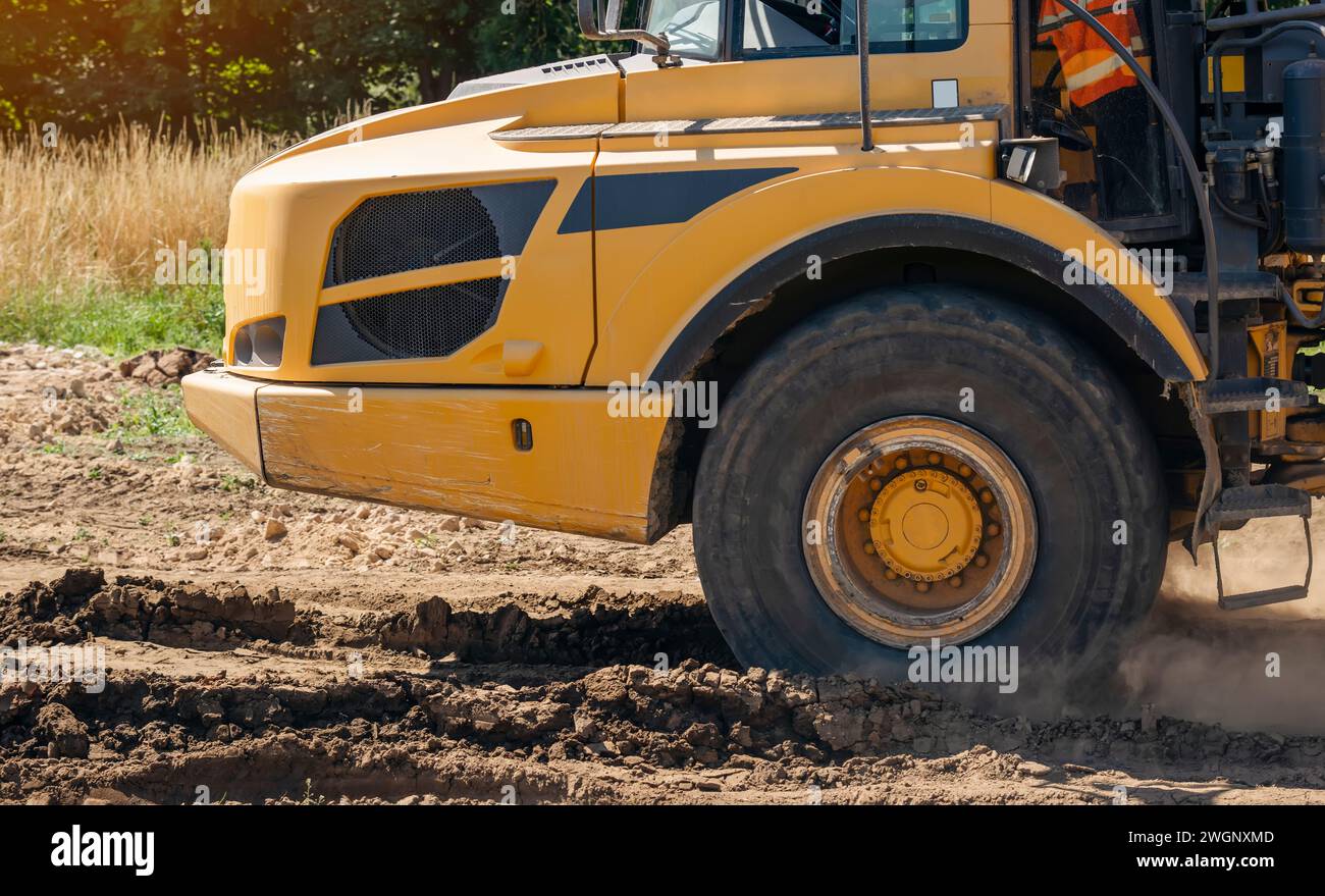 Close-up of the big yellow articulated dump truck earth mover Stock ...