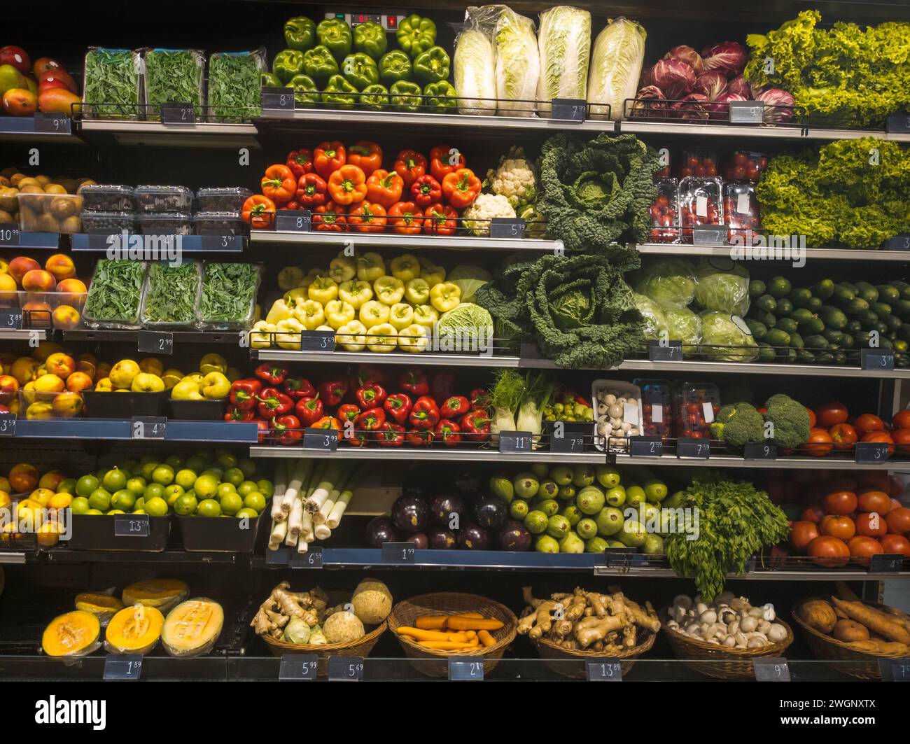 supermarket rack full of various types of vegetables Stock Photo - Alamy