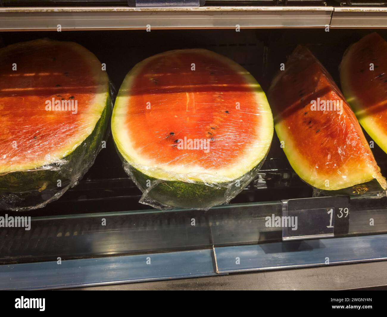 watermelon displayed on supermarket shelf Stock Photo - Alamy
