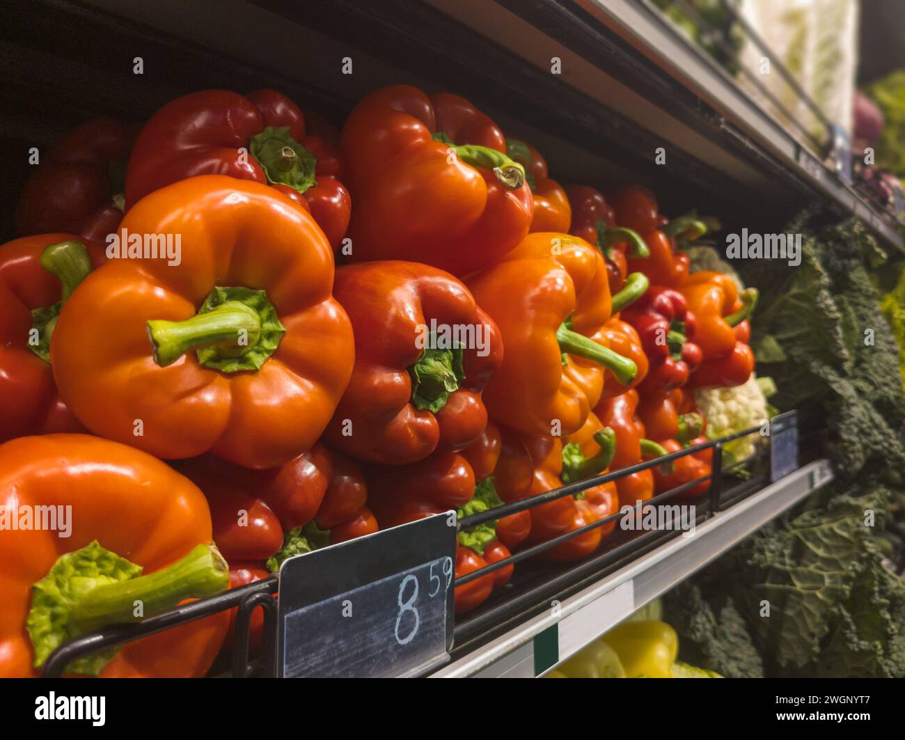 red peppers at vegetable rack in supermarket Stock Photo - Alamy