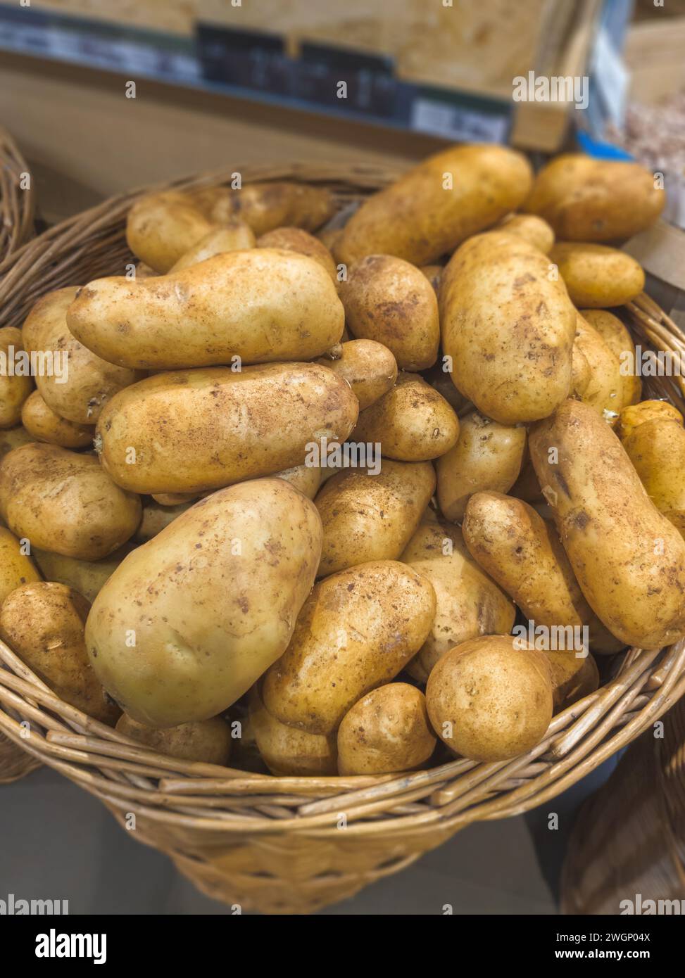 potatoes for sale in basket in supermarket Stock Photo - Alamy