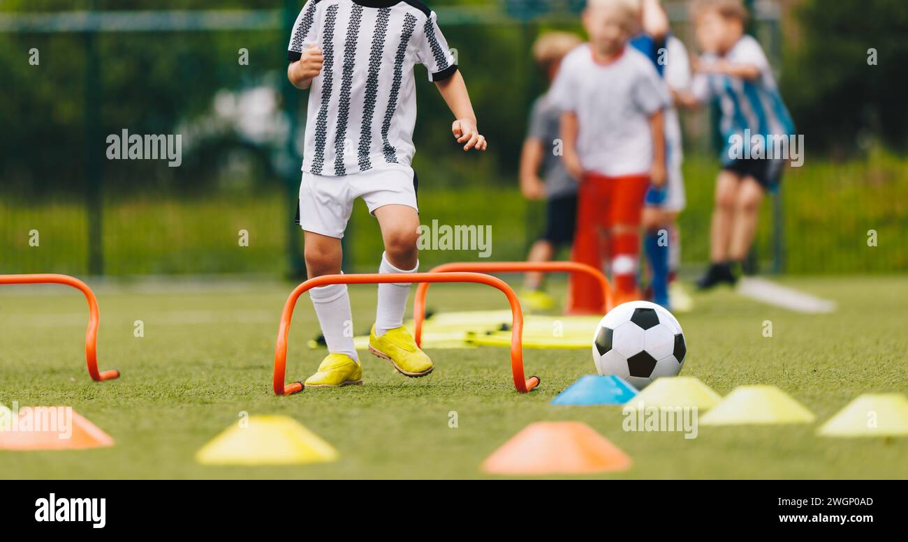 Little children on physical education training with a coach. Sporty ...