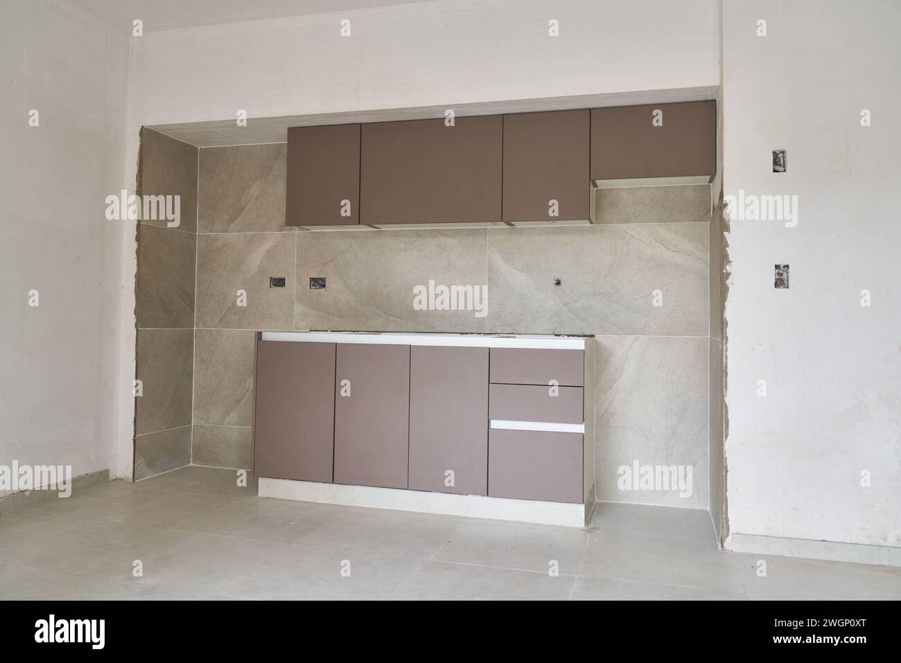 Wooden cabinets with counter inside kitchen Stock Photo - Alamy