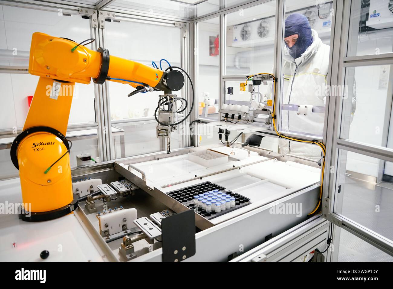 Mannheim, Germany. 06th Feb, 2024. An employee stands at a robot for ...