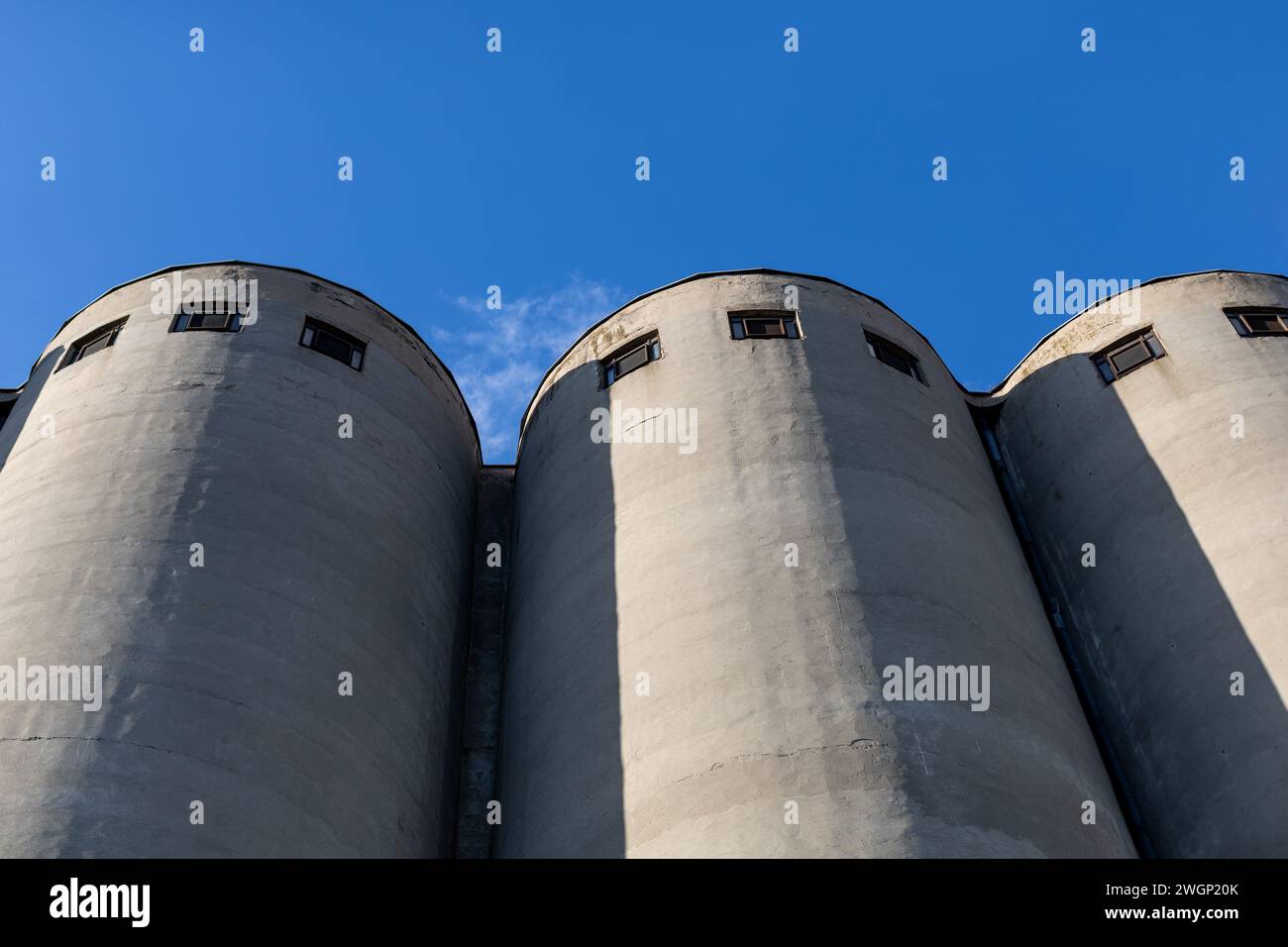 huge grain silos with windows on top Stock Photo - Alamy