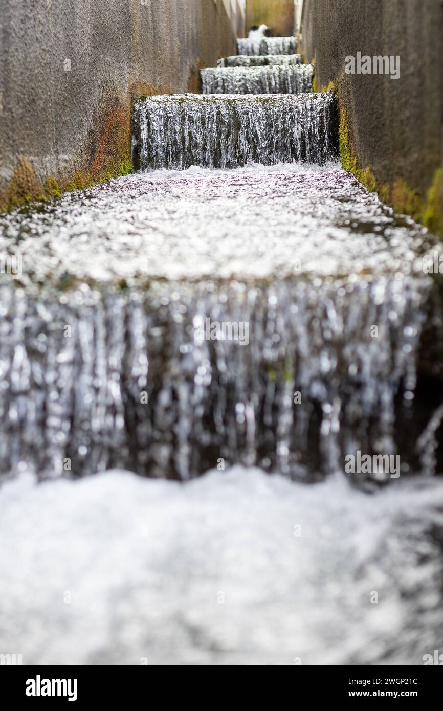 cascading water flowing through concrete tunnel Stock Photo - Alamy