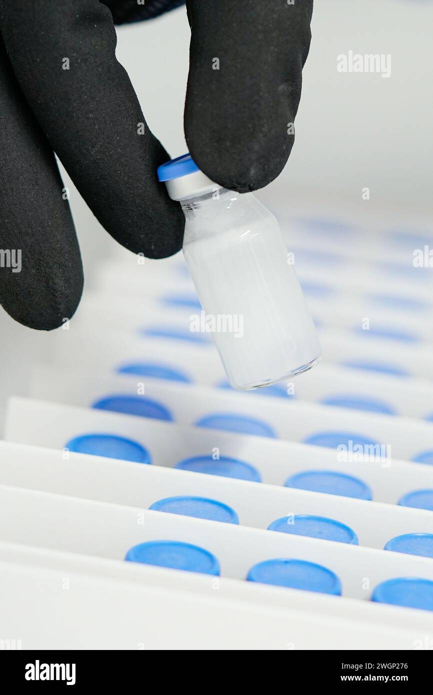Mannheim, Germany. 06th Feb, 2024. An employee holds a vial containing ...