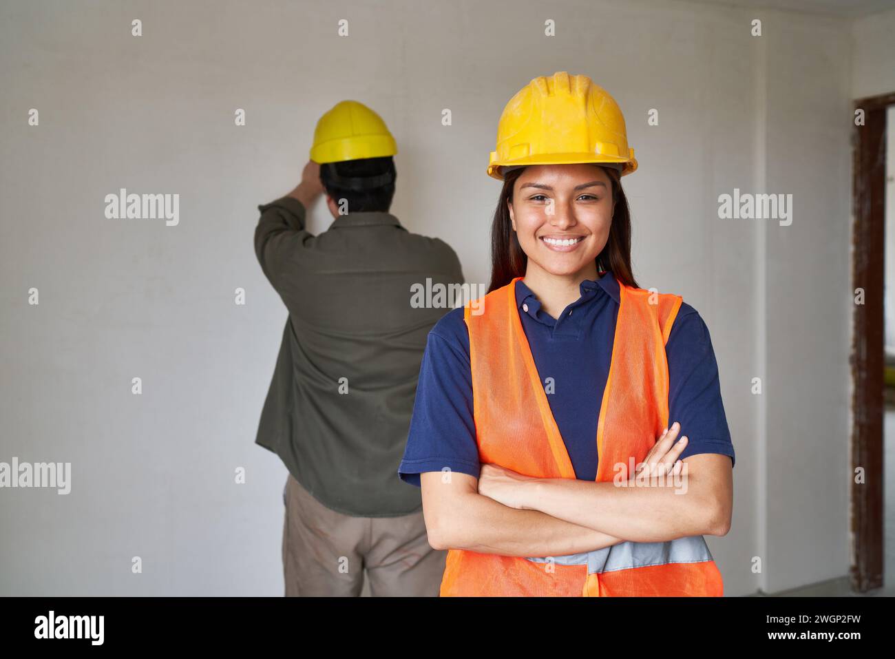 Smiling professional female construction hi-res stock photography and ...