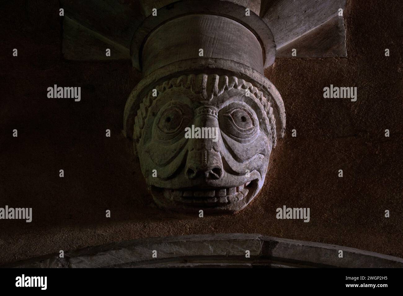 Grotesque face, sculpted in the 1100s, decorates corbel in Norman ...