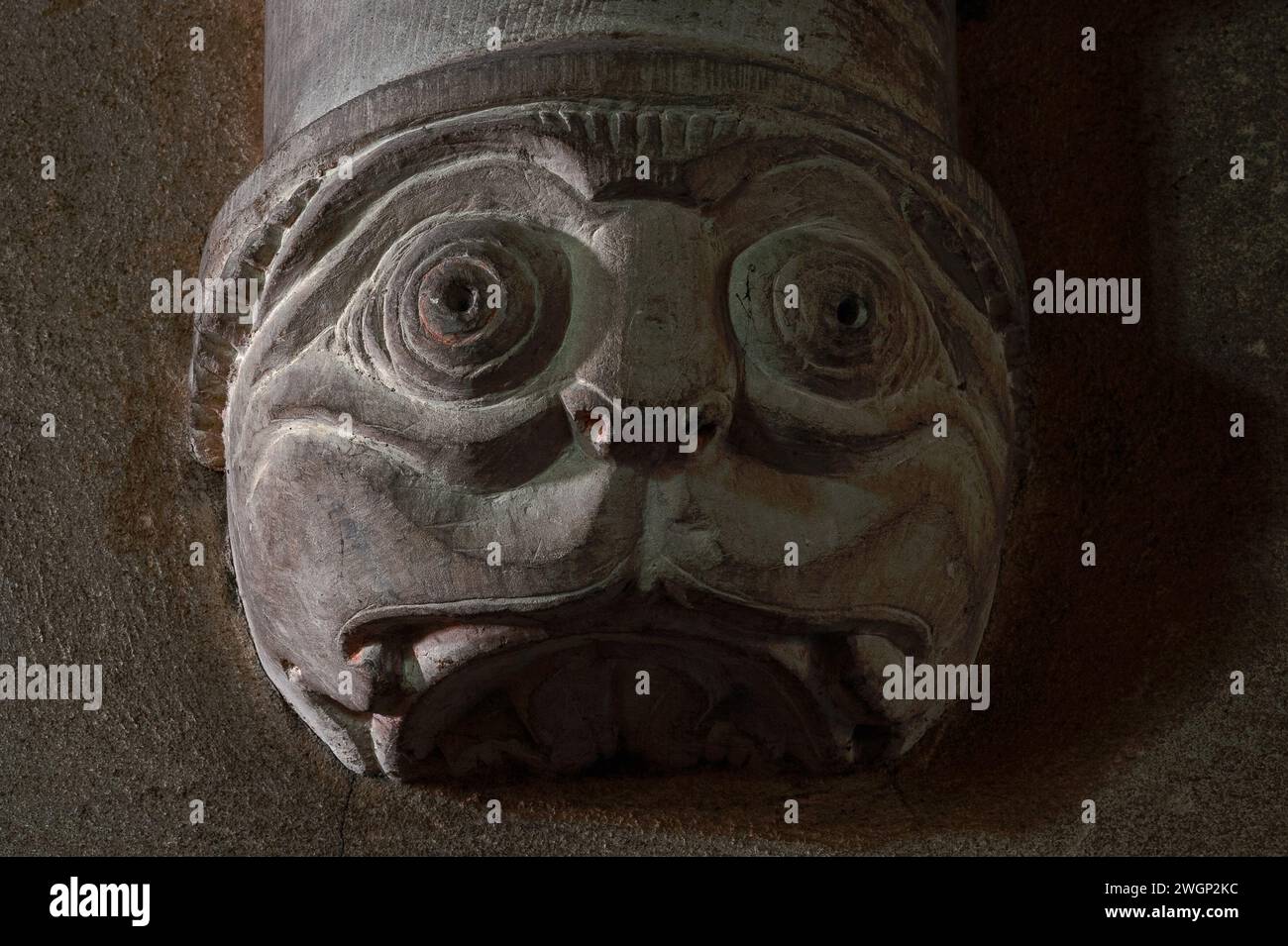 Goggle-eyed face, sculpted in the 1100s, decorates corbel in Norman ...
