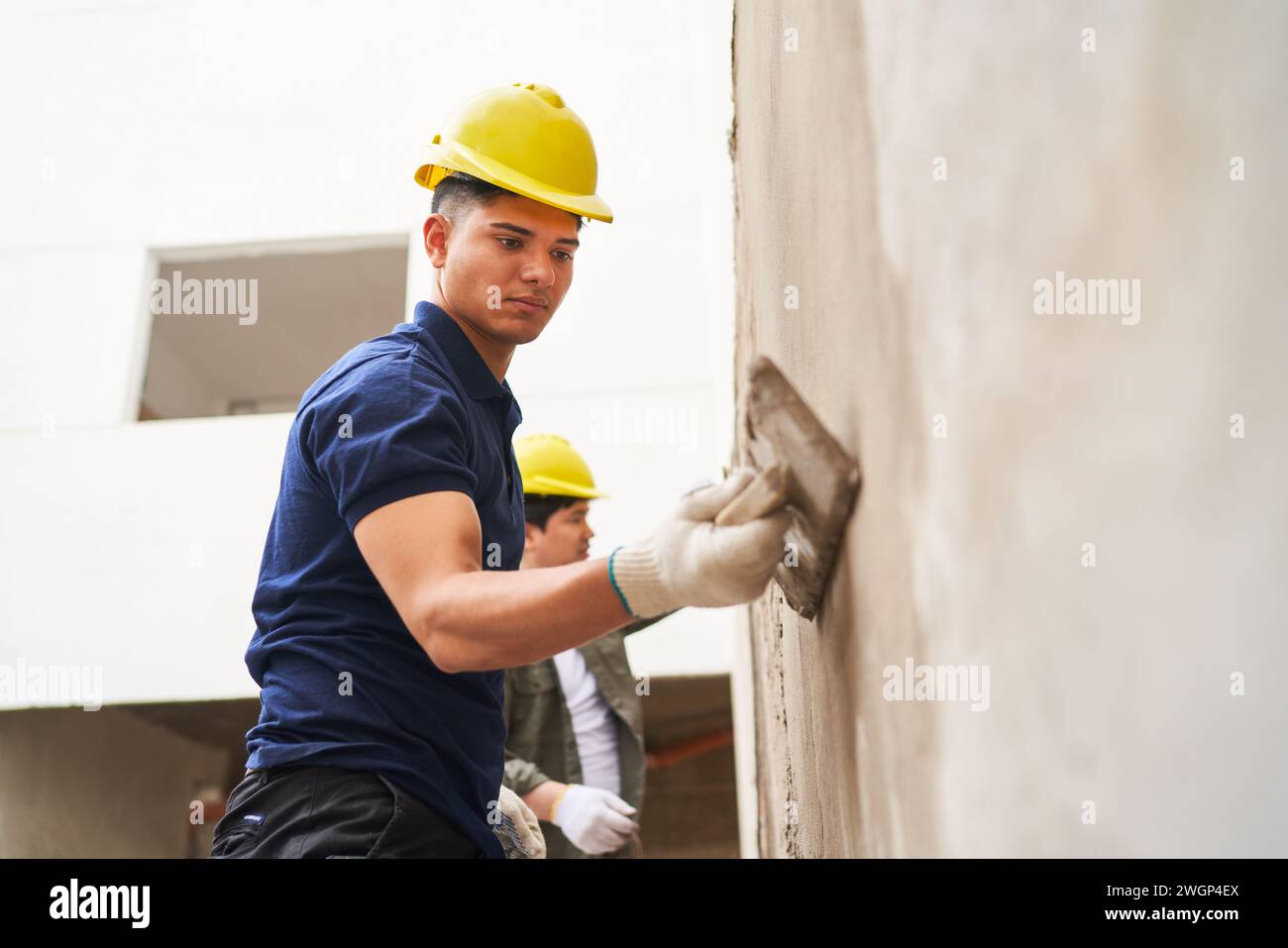 Man applying cement hi-res stock photography and images - Alamy