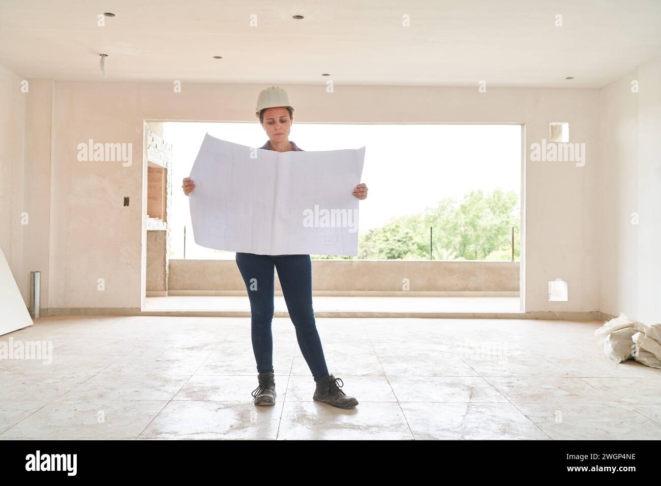 Female architect house plan hi-res stock photography and images - Alamy