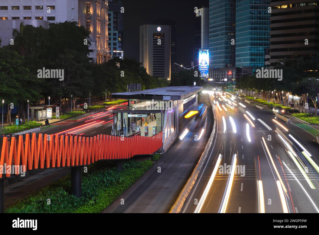 A picture of Jakarta business district traffic at night with long ...