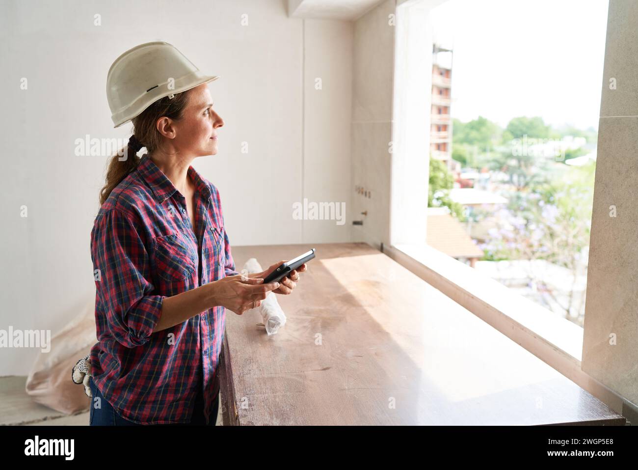 Supervisor looking through window hi-res stock photography and images ...