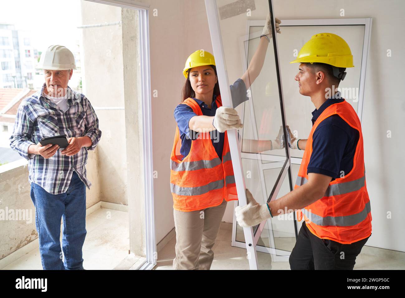Man fitting window frame hi-res stock photography and images - Alamy