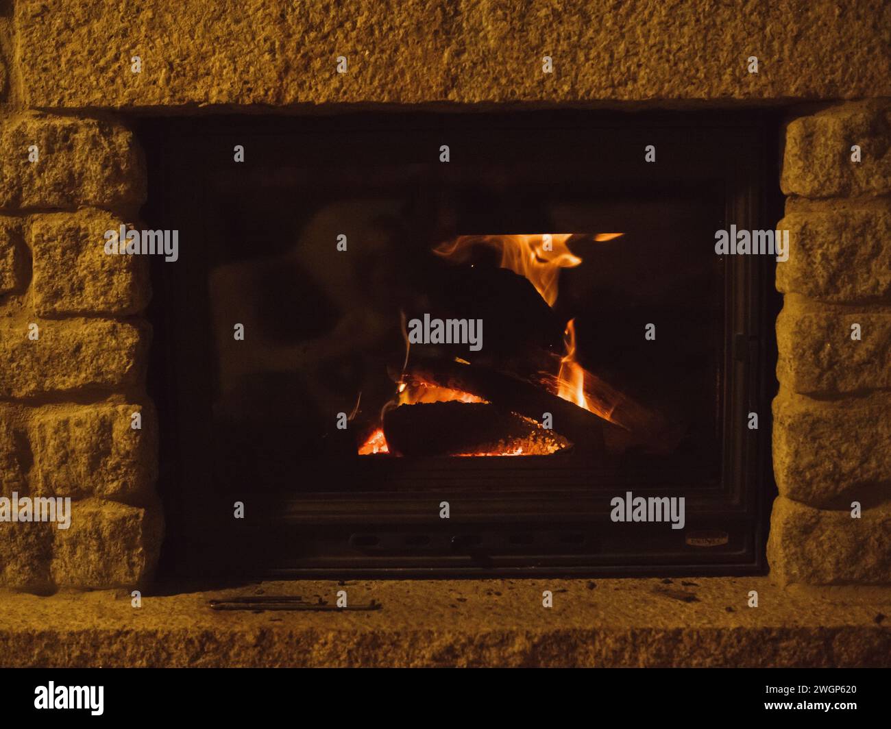 Horizontal low light close up image of an Italian fireplace in a ...