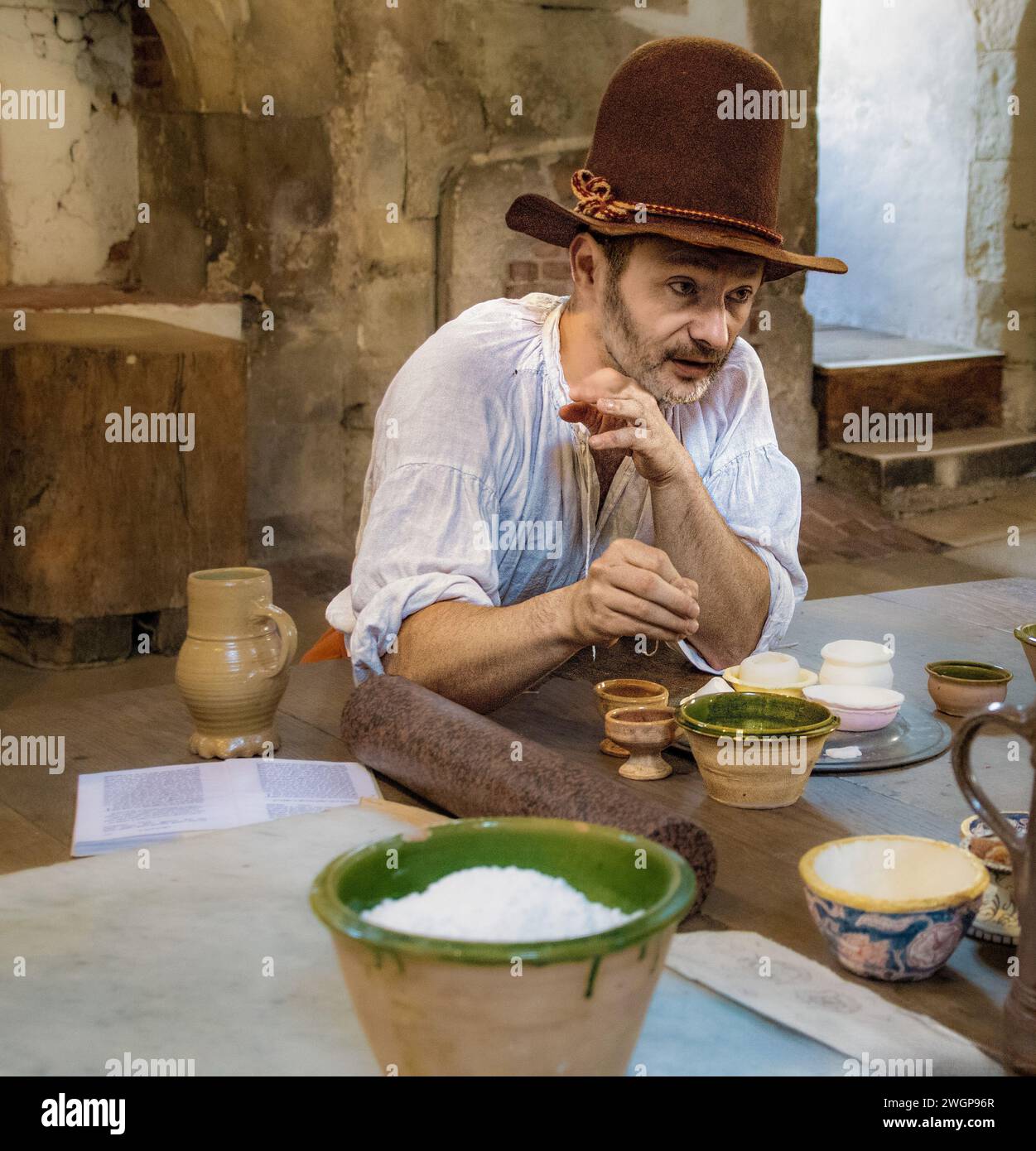 Hampton court Palace England August 1st 2023 a tudor chef preparing a ...