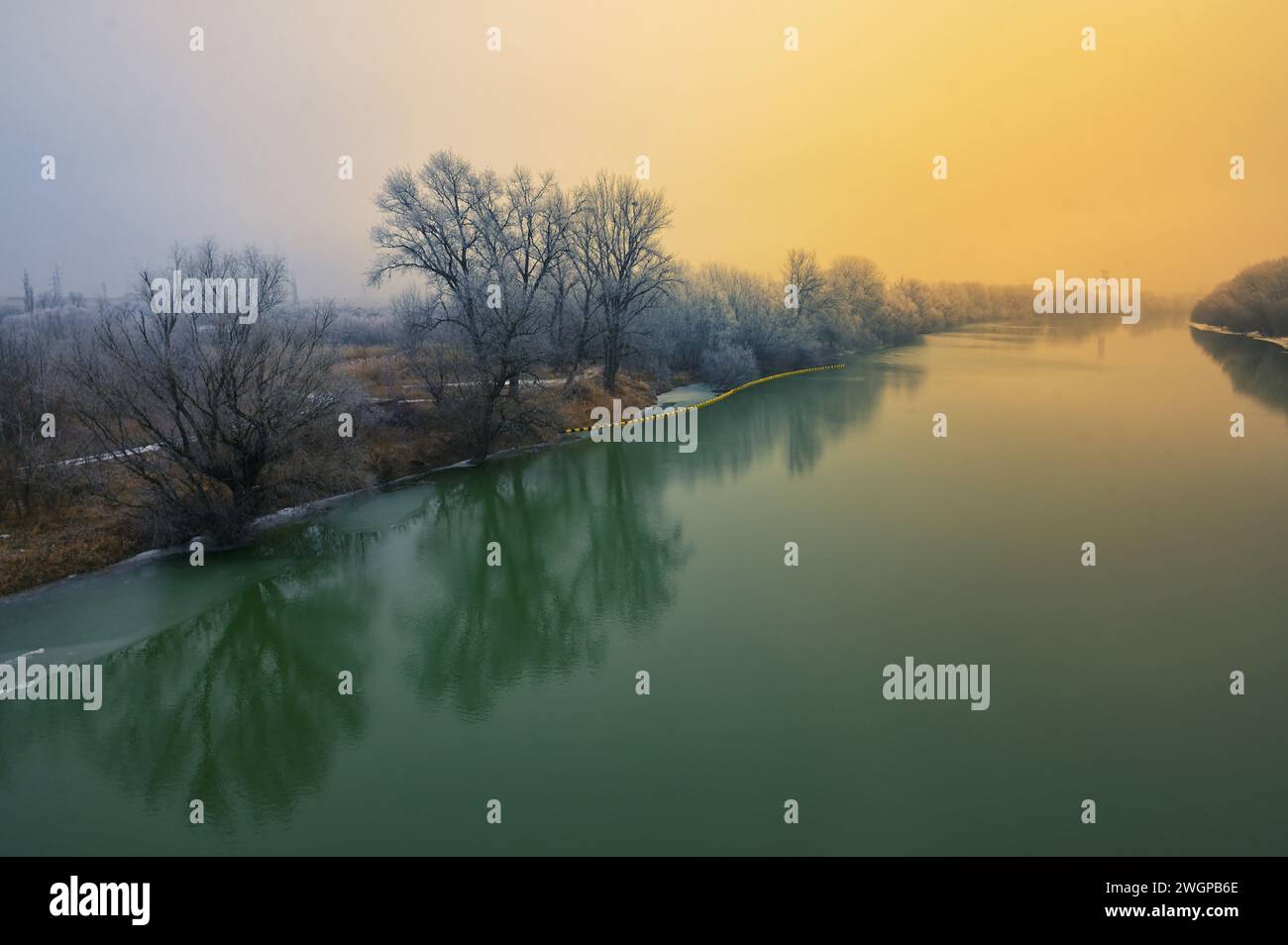 Beautiful winter sunrise and fog on Siret river Stock Photo - Alamy