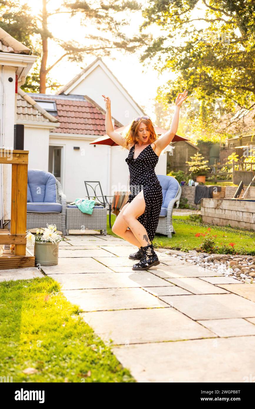 Woman dancing garden party hi-res stock photography and images - Alamy