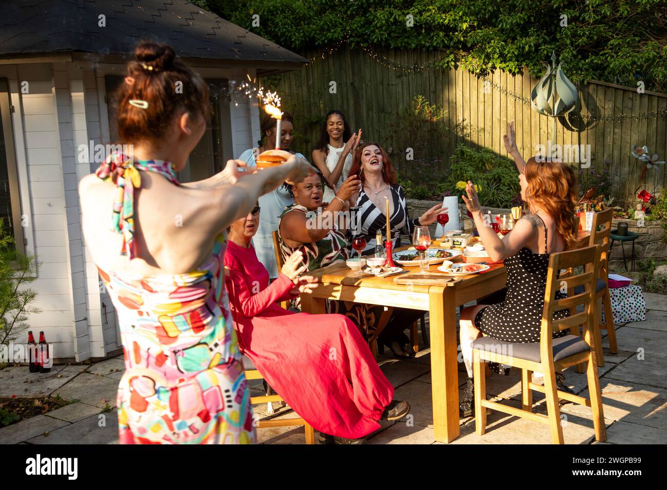 People laughing at dinner table hi-res stock photography and images - Alamy